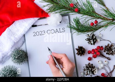 2023 goals paper sheet around christmas new year decorations. Planning ...