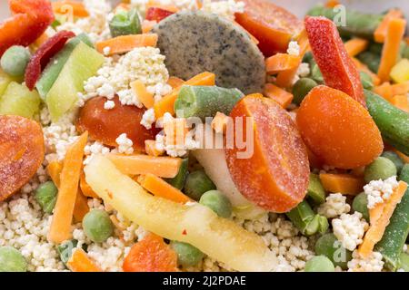 Frozen mix of couscous, vegetables and sauce for quick preparation ...