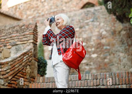Senior lady spending time at urban area Stock Photo - Alamy