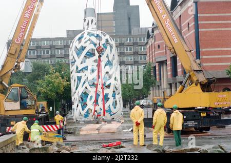 The sculpture 'Bottle of Notes' is lifted off its low loader in the ...
