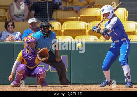 LSU catcher Morgan Cummins (26) throws during an NCAA softball game ...
