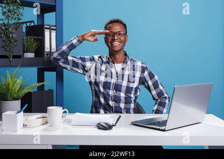 Office worker doing military salute to show respect and patriotism ...