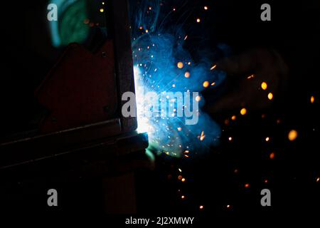 Metal welding. Fire from operation of welding machine. Manufacture of ...