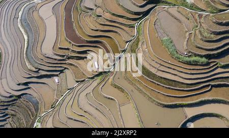 Aerial photo shows the scenery of terraced fields after snow in She ...