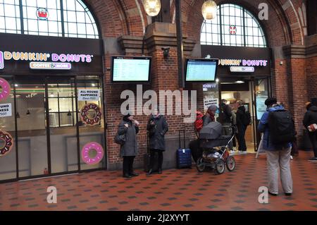 Copenhagen/Denmark/.04 April 2022/.Custmers waiting at Dunkin'Donuts ...