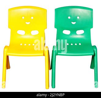 Two yellow colorful plastic empty clothespin hanging on rope in outdoor ...