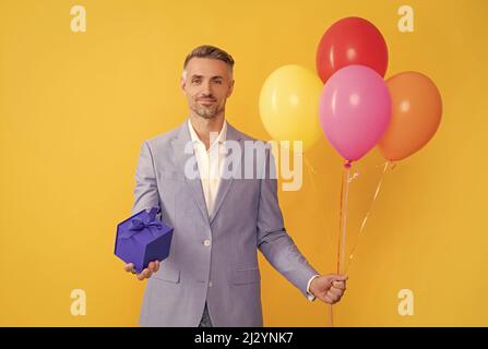 Buy present for any occasion. Handsome guy give present to sensual girl ...