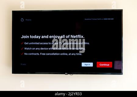 Netflix sign up screen on TV screen wall mounted Stock Photo - Alamy