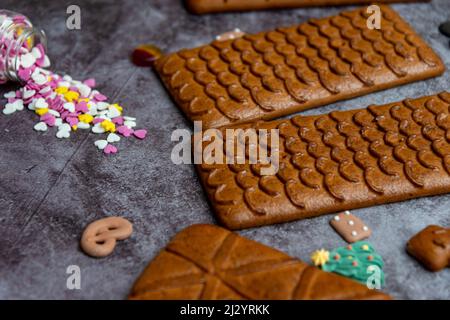 Gingerbread house parts and decorations on a gray background Stock ...