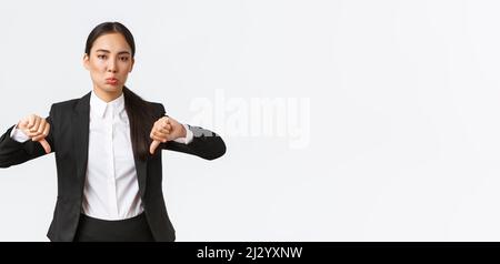 Unamused skeptical female office manager, saleswoman in black suit ...