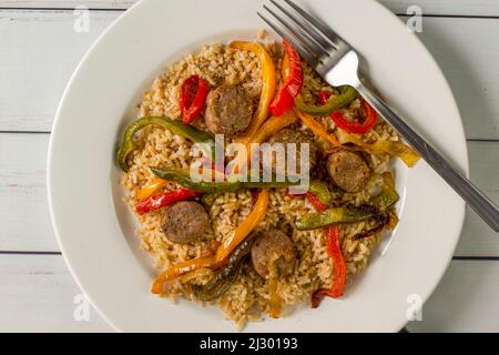 brown rice top with onions peppers and onions Stock Photo - Alamy