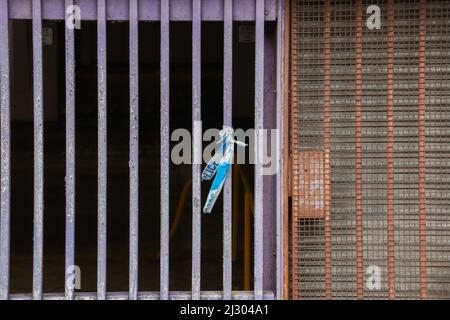 Remnant of police cordon tape tied to railing on Mount Pleasant ...
