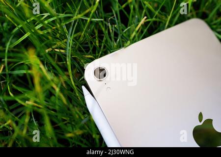 Macbook Pro laptop computer rear view with Apple logo on the lid ...