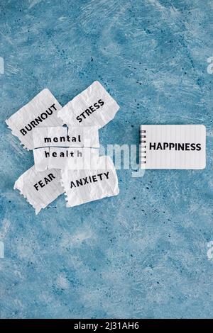 Fear text on torn page thrown inside trash bin, concept of overcoming ...