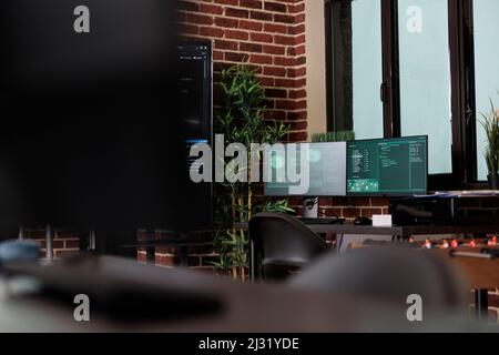 Empty office with multiple monitors showing hacking attack alert, IT ...
