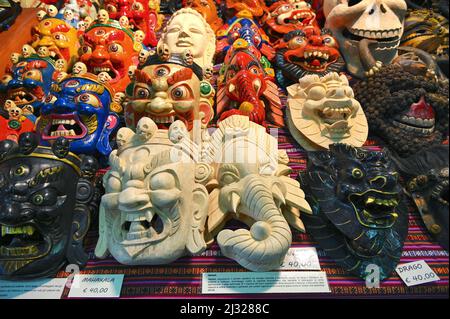 The wooden carved handmade Hindi masks statues and jewelry on display ...