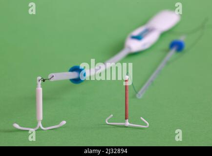 T-shaped intrauterine birth control device with condoms. Contraception ...