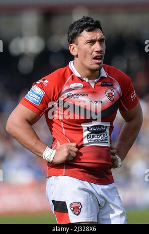 Elijah Taylor #13 of Salford Red Devils passes the ball during the game ...