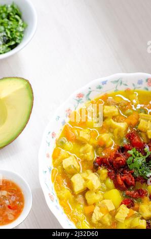 Plate with tripe soup, called mondongo, traditional food from Colombia ...