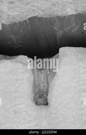 Deconstructed concrete slabs with boring holes and fitted on top of ...