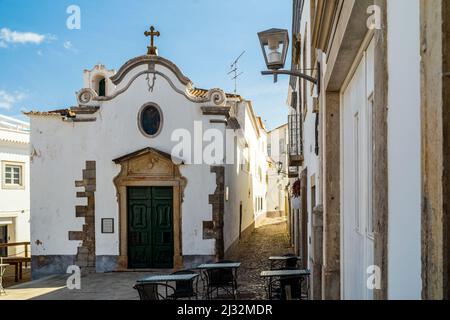 Charming chapel of Our Lady of Pity between narrow streets of Tavira ...