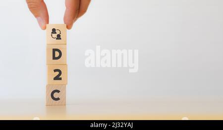 Direct to Customer D2C concept. Hand putting a block with icon and text ...