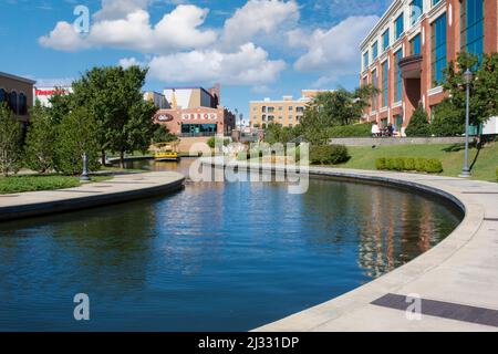 USA, Oklahoma, Oklahoma City, Water taxi navigating Bricktown Canal ...