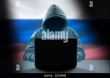 Russian hooded computer hacker Stock Photo - Alamy