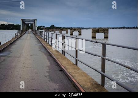 A single gauge steel bridge spans the waters of the Vaal dam on the ...