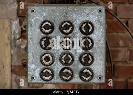 Aged metal control panel with switches and analogue gauges in craft ...