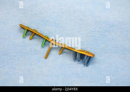 a titanium surgical plate and titanium screws for the treatment of a ...