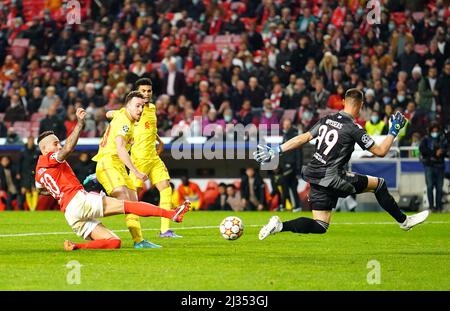 Liverpool's Diogo Jota (left) attempts a shot on goal during the UEFA ...
