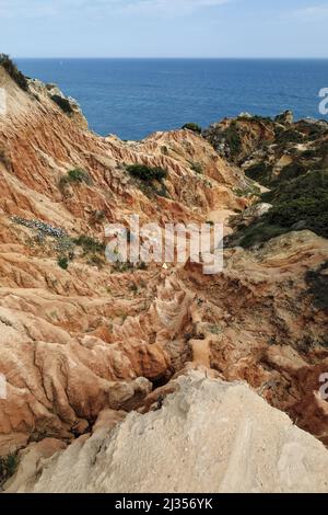 Badlands and landslides-red sands-contour of Praia da Marinha Beach ...