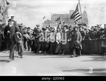 Suffragettes marching in New York with a young baby. Photo from ...