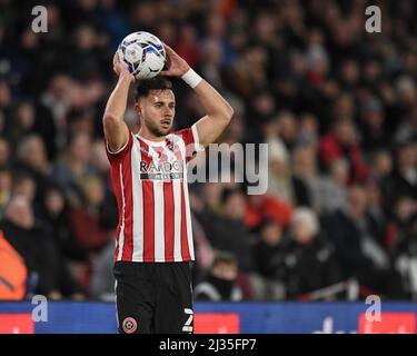 George Baldock #2 of Sheffield United takes on Jamie Paterson #12 of ...