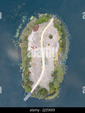 Isaland surrounded by water with S shape path Stock Photo - Alamy