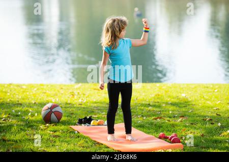 Sport children. Child with strong biceps muscles. Sport exercise for ...
