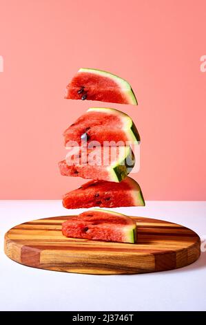 Flying watermelon. Sliced falling watermelon isolated on white ...