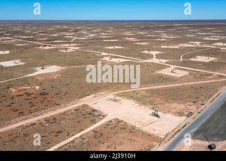 a producing oil well in the Texas panhandle crude oil storage tanks in ...