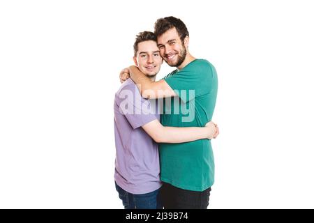 Young gay couple standing over isolated background smiling in love ...