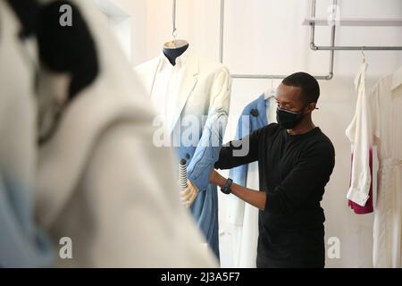 Kigali, Moshions shop in Kigali. 1st Apr, 2022. Moses Turahirwa, the ...