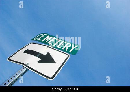 Arrow pointing to cemetery location on roadway Stock Photo - Alamy