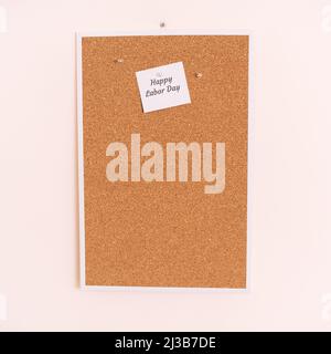 Happy labor day sticker nailed to chalkboard Stock Photo - Alamy