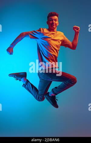 Levitation. Excited young man in vintage fashion style costume, suit ...