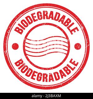 BIODEGRADABLE text written on red grungy zig zag borders round stamp ...