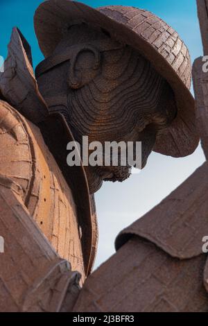 Statue of a British WW1 soldier, wearing a Brody helmet and carrying an ...