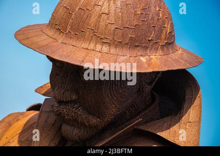 Statue of a British WW1 soldier, wearing a Brody helmet and carrying an ...