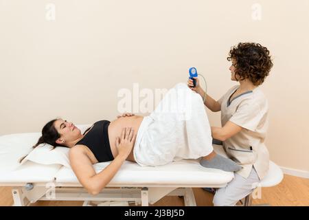 Gynecologist holding a pelvic floor muscle exercise device to prepare ...