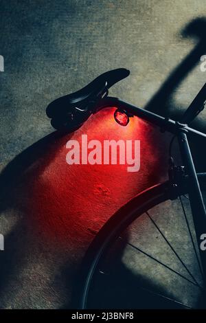 Rear red bicycle light on white background Stock Photo - Alamy