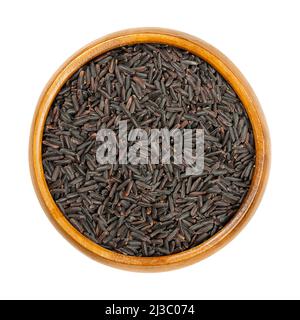 Rice grains on wooden background Stock Photo - Alamy